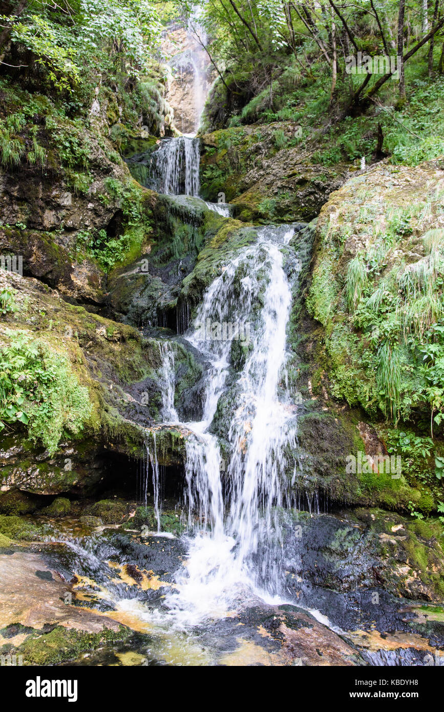 Dreamy waterfall and small emerald pond. Karst water. Fontanon of ...