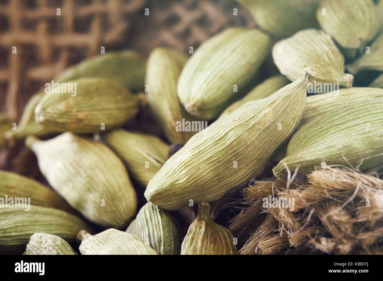 Closeup of raw green cardamom pods burlap sack Stock Photo - Alamy