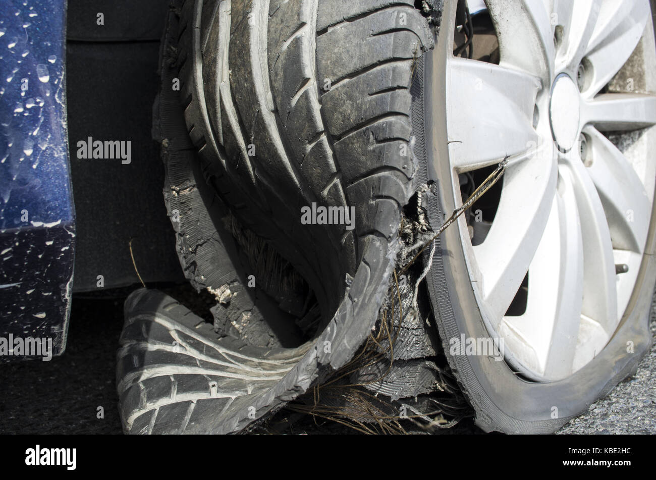 damaged tire after tire explosion at high speed on highway Stock Photo ...