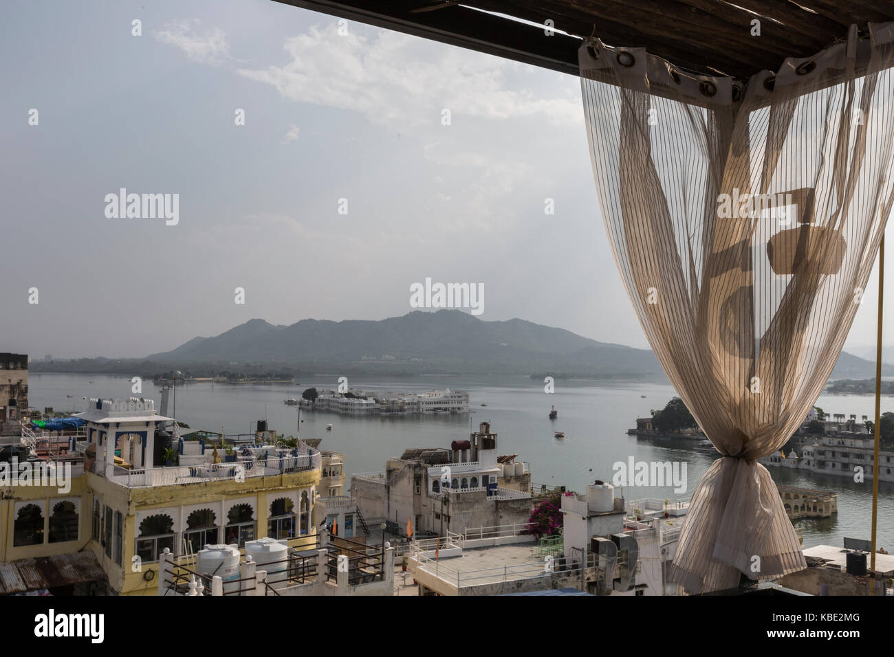 Roof top restaurant with beautiful view to Lake Pichola in the morning ...