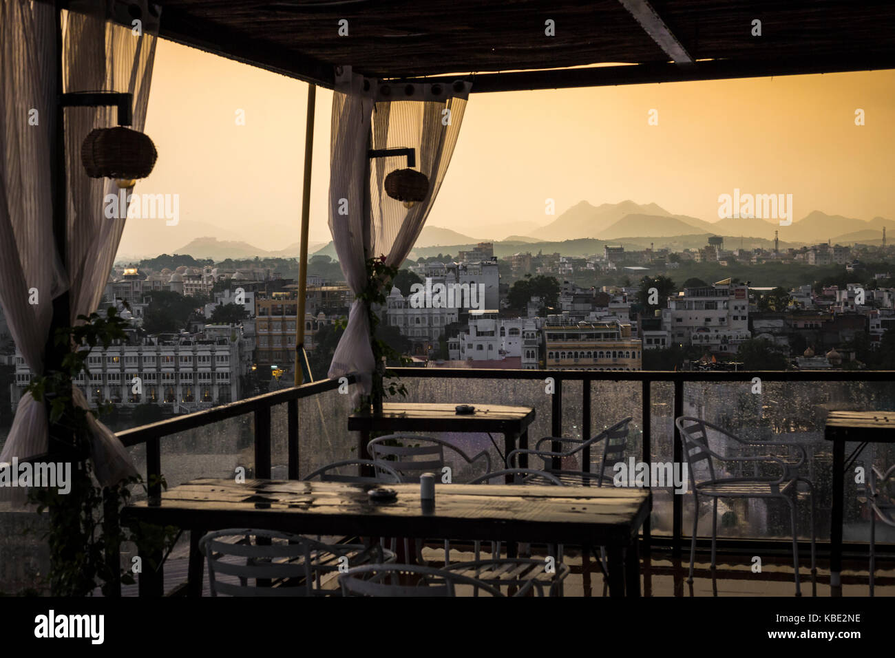 Roof top restaurant with beautiful view to Lake Pichola in the morning ...