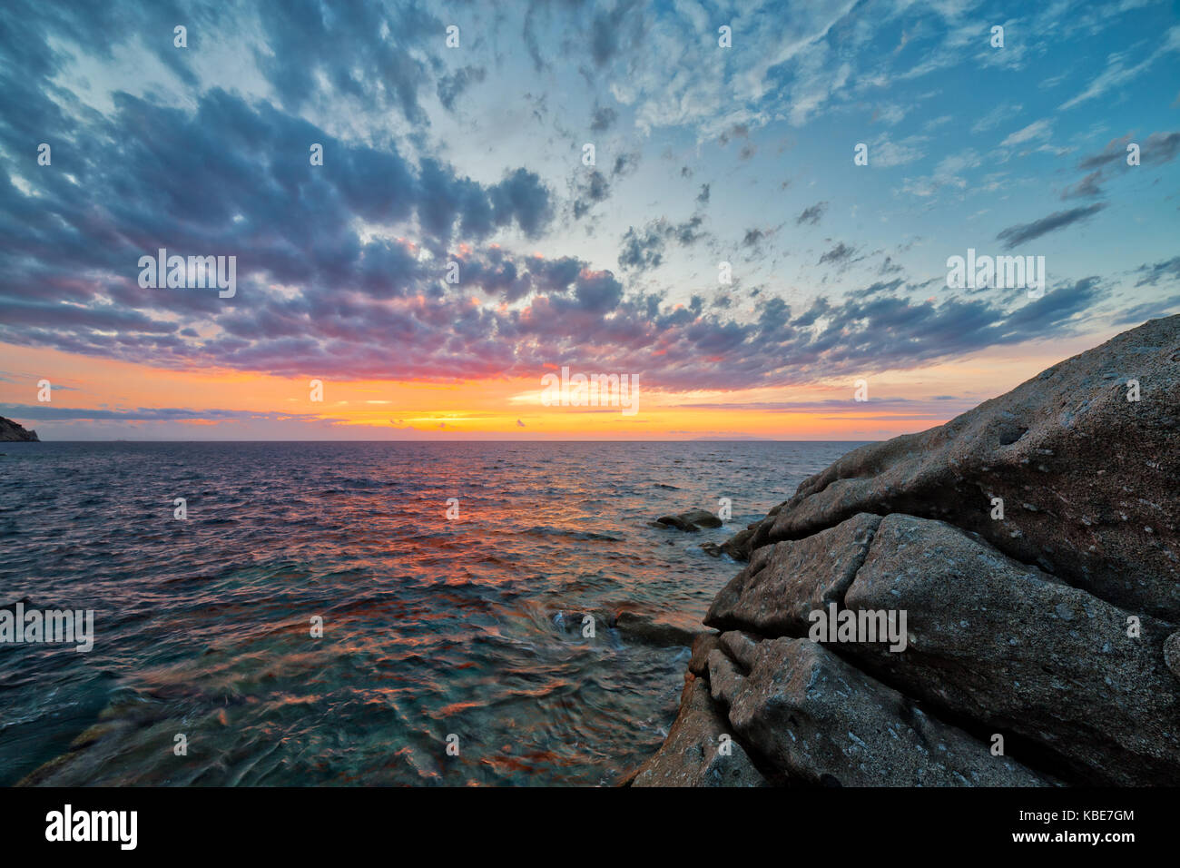 Scenic coastal sunset with orange light on island of Elba Stock Photo ...