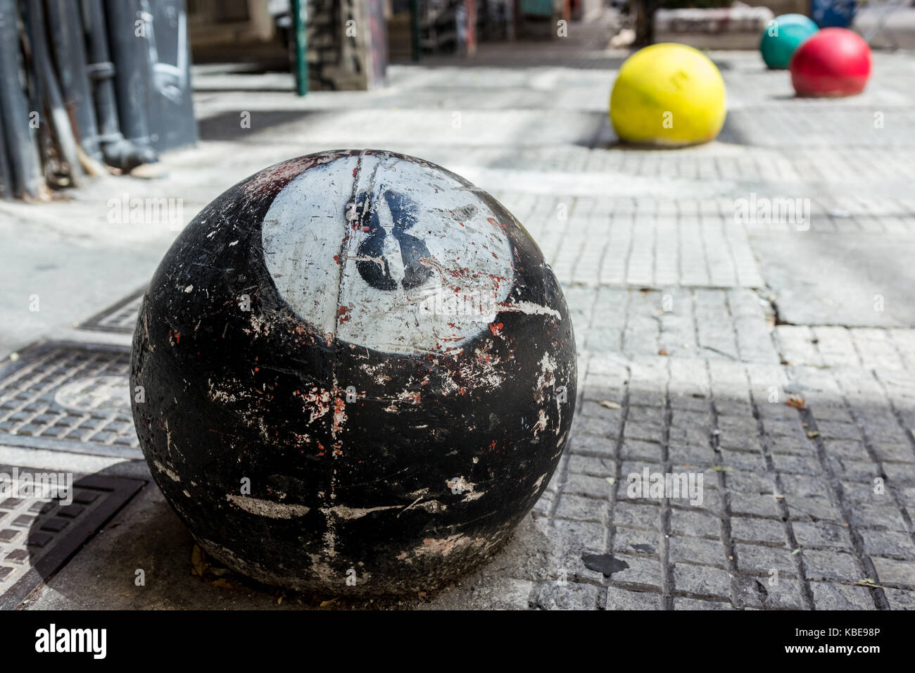 A huge worn-out 8-ball made of concrete on the pavement Stock Photo - Alamy
