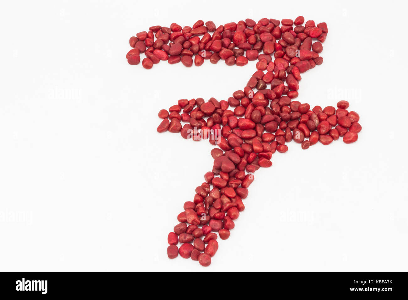 The number seven made by little red stones, put one next to the other ...