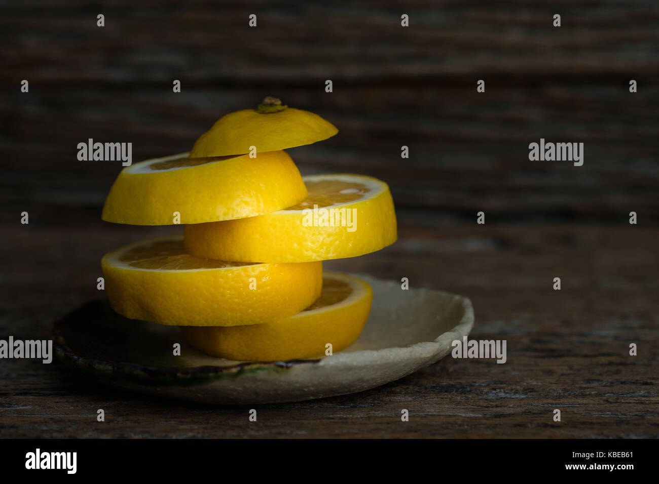 Still life with lemons on rustic low key background, Choose focal point ...