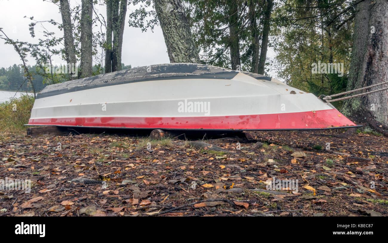 Row boat in winter storage Stock Photo - Alamy