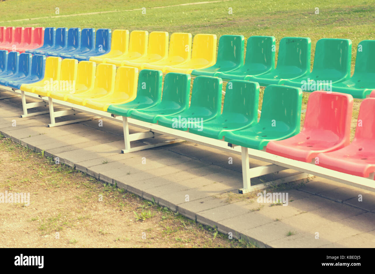 Multicolored benches for sports fans standing in two rows Stock Photo ...