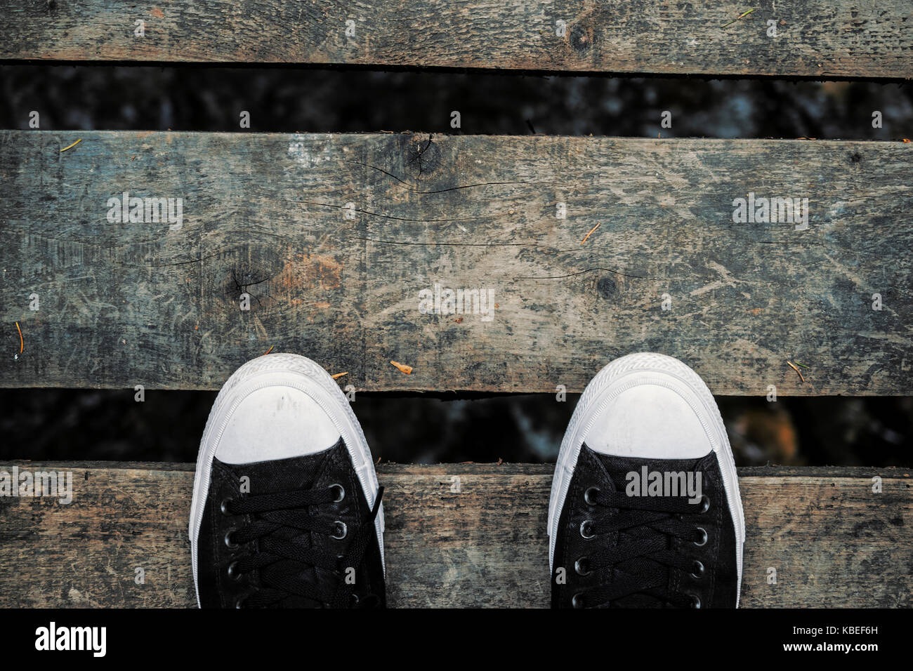 High Angle View Of Shoes On Rustic Wooden Bridge Stock Photo - Alamy