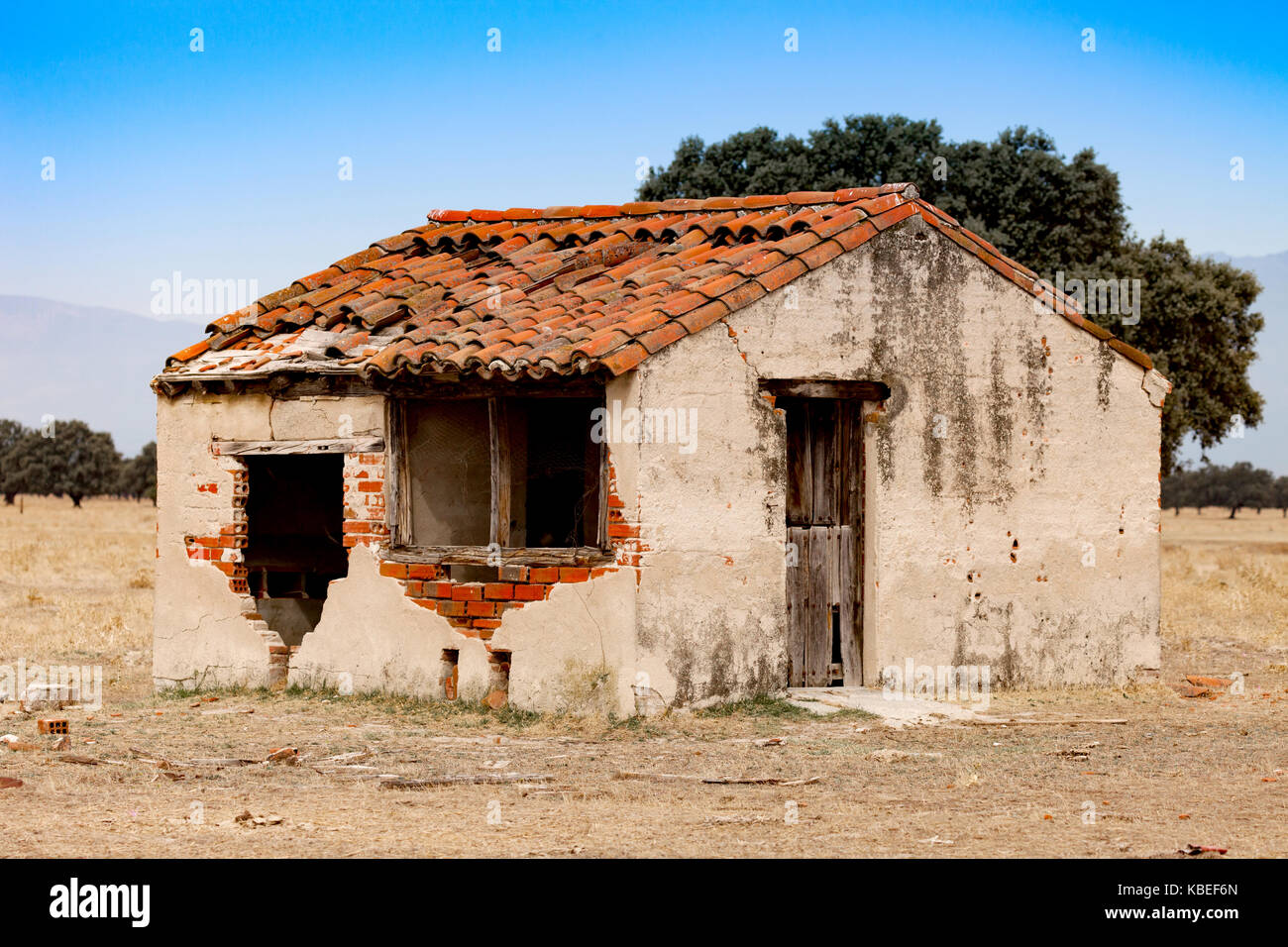 Small old house with the roof collapsed and a broken window Stock Photo ...