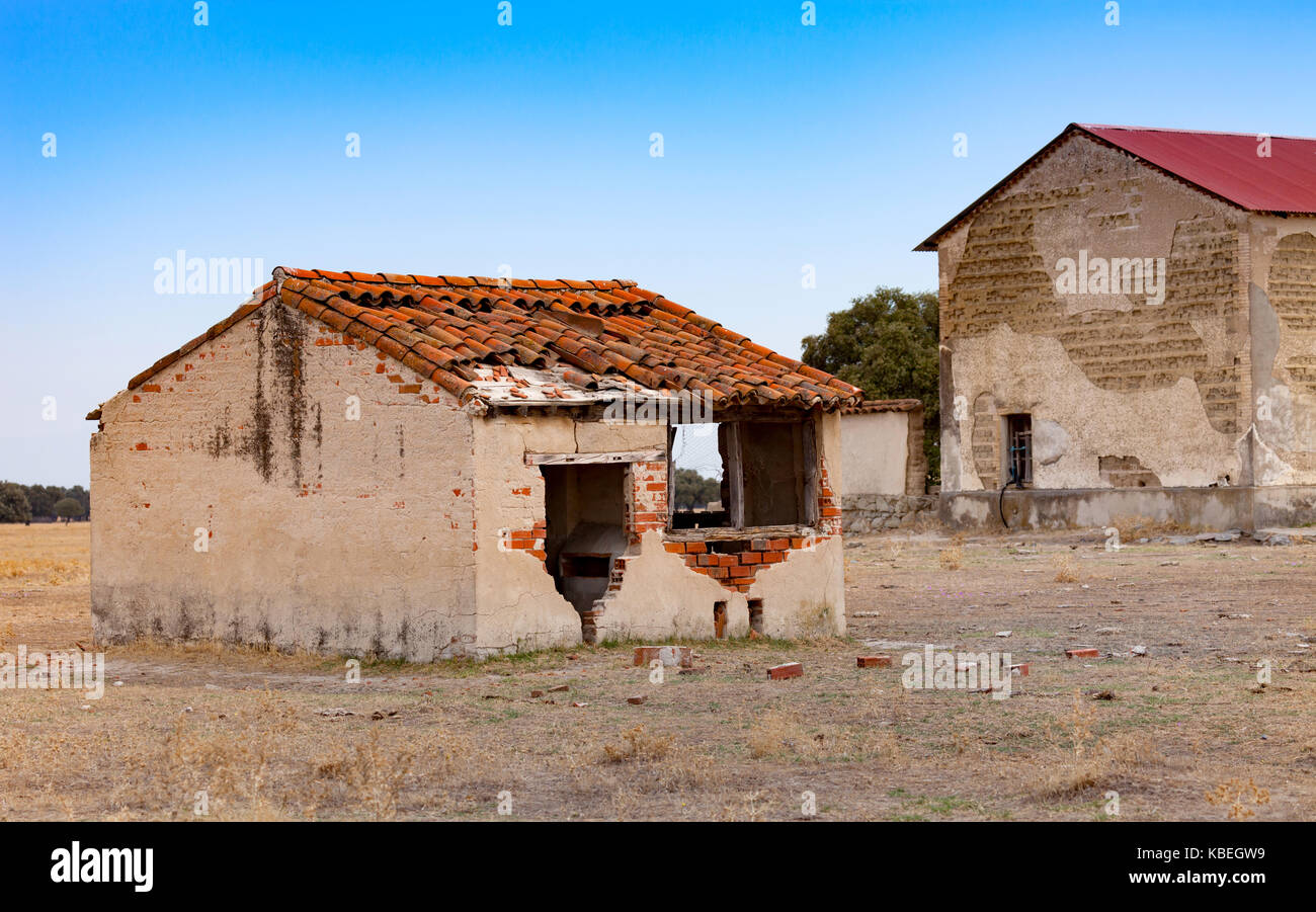 Small old house with the roof collapsed and a broken window Stock Photo ...