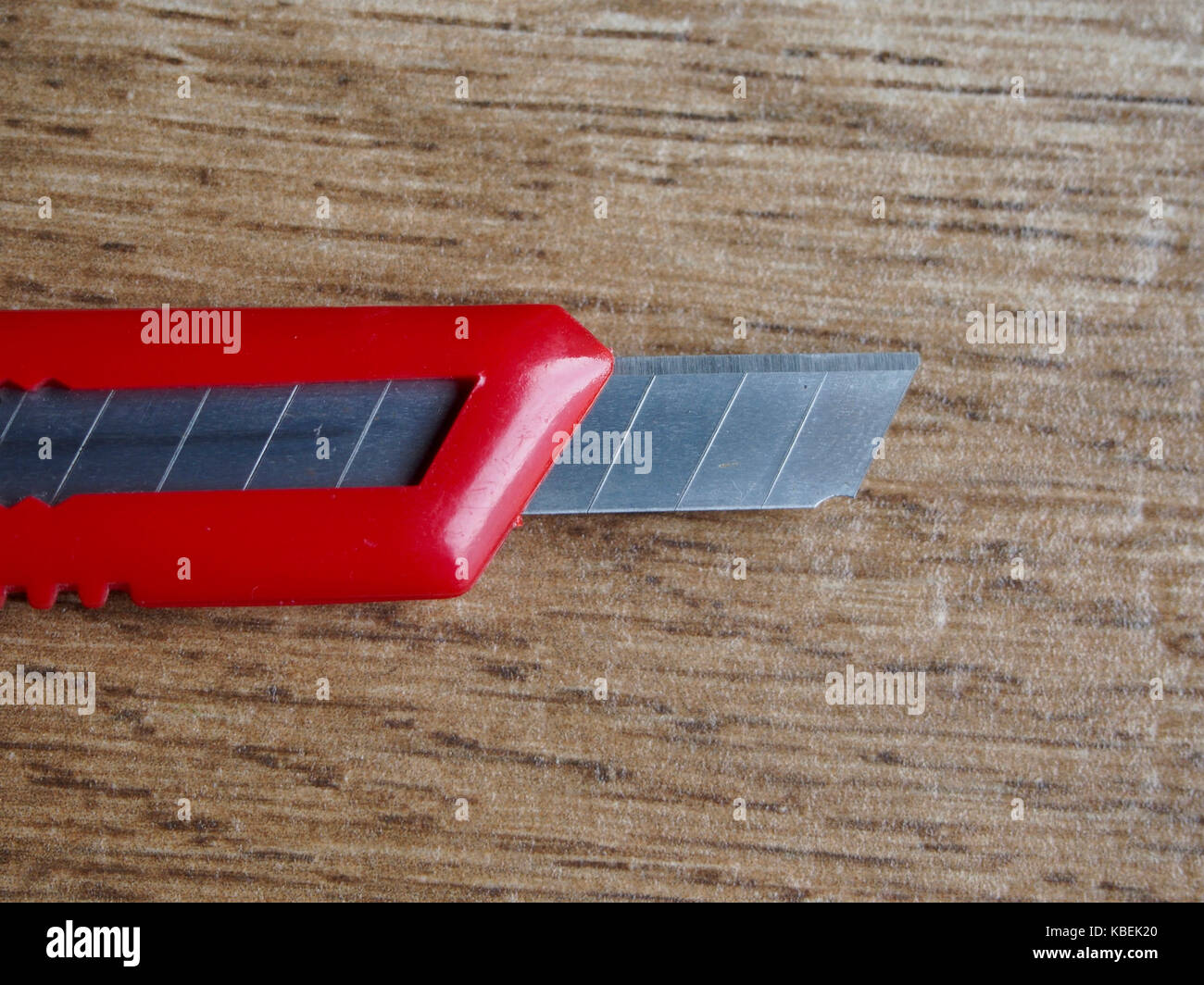 Cutter on wood background Stock Photo - Alamy