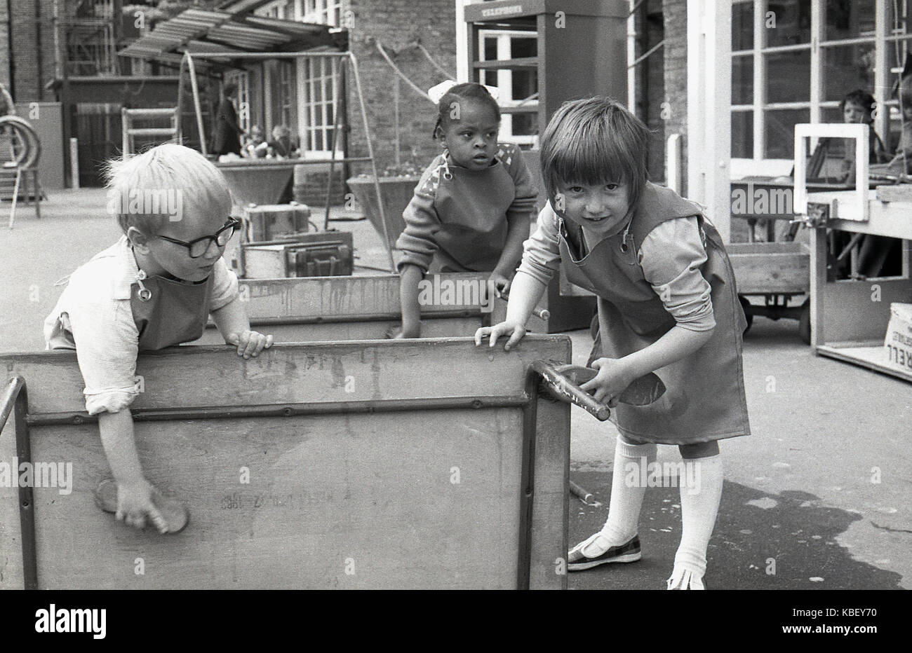 1970s, historical picture of three happy young children wearing ...