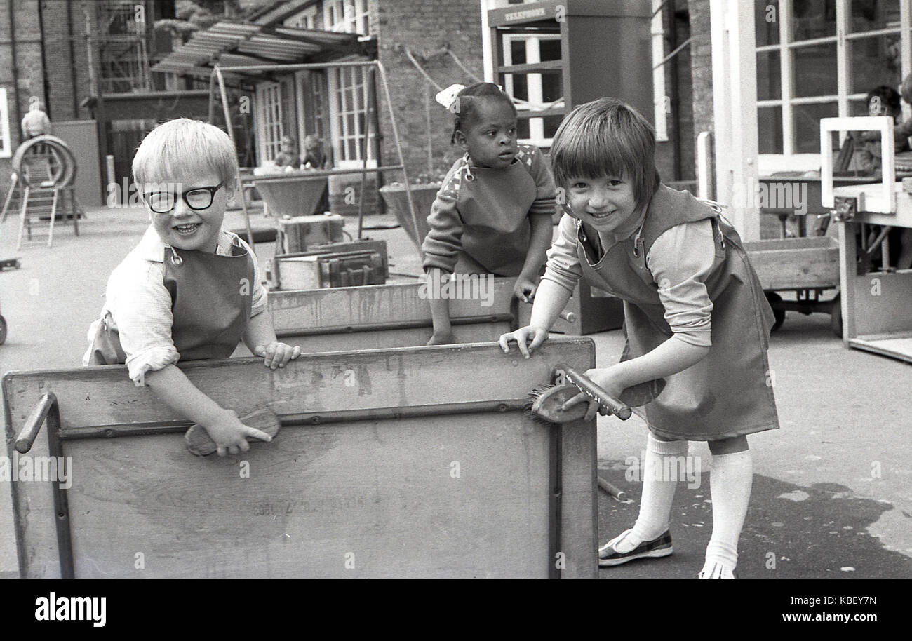 1970s, historical picture of three happy young children wearing ...