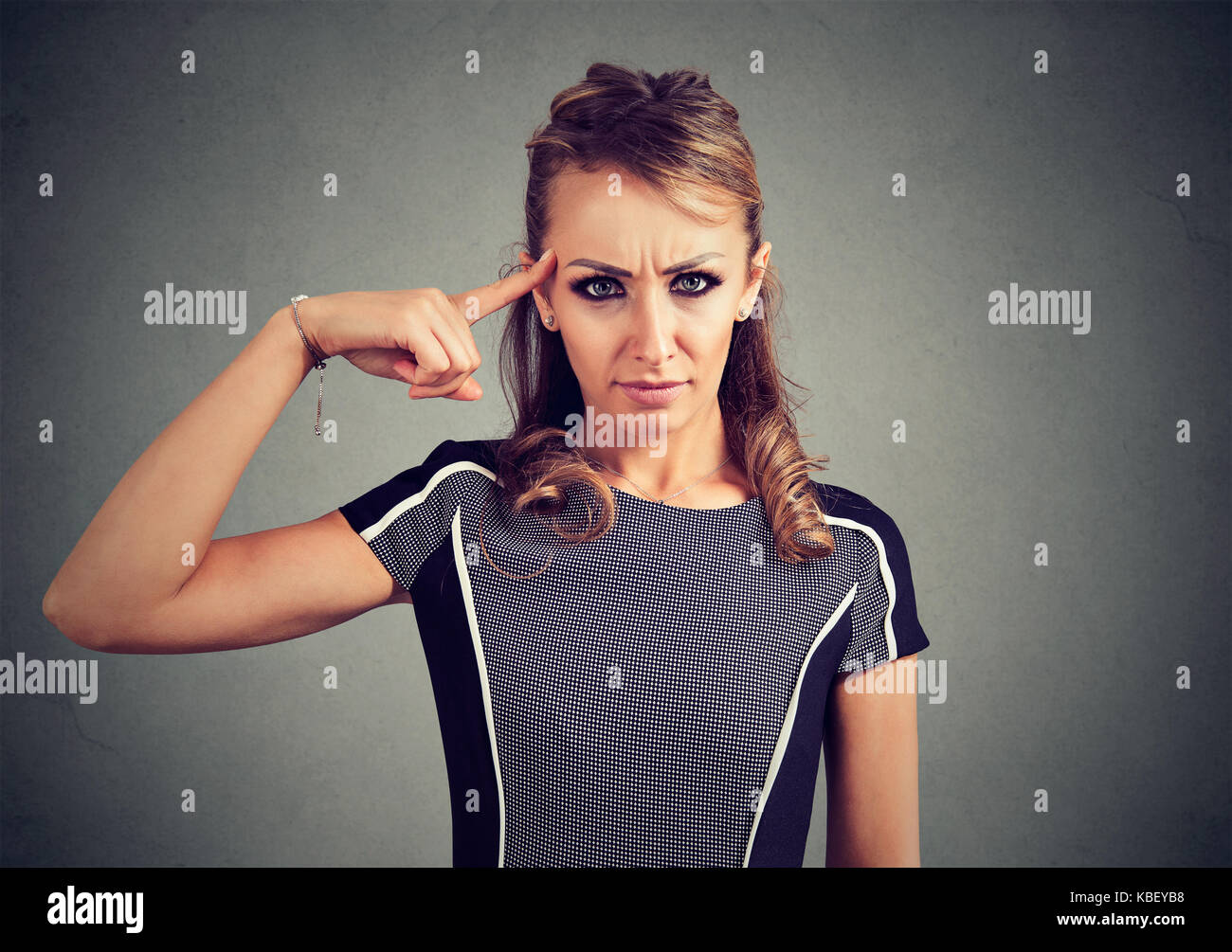 Angry woman gesturing with finger are you crazy Stock Photo - Alamy