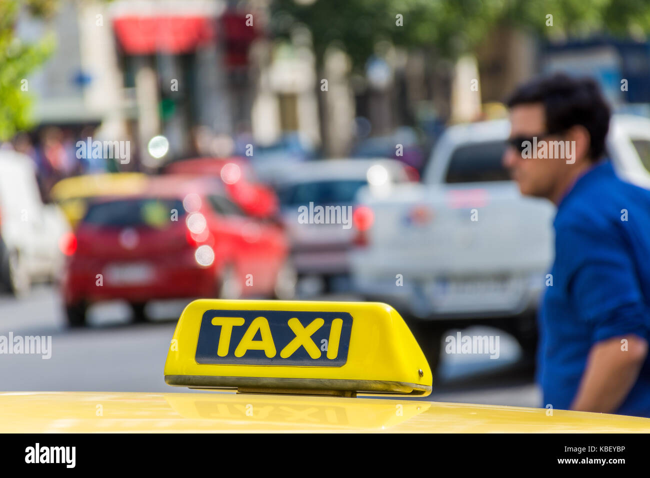 Yellow taxi sign on cab vehicle roof Stock Photo - Alamy