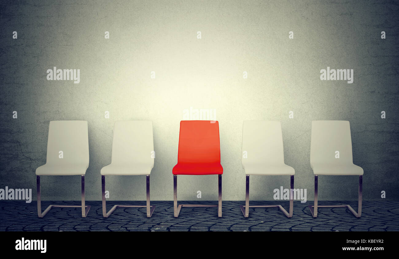 One opening for the job business concept. Row of white chairs and one ...