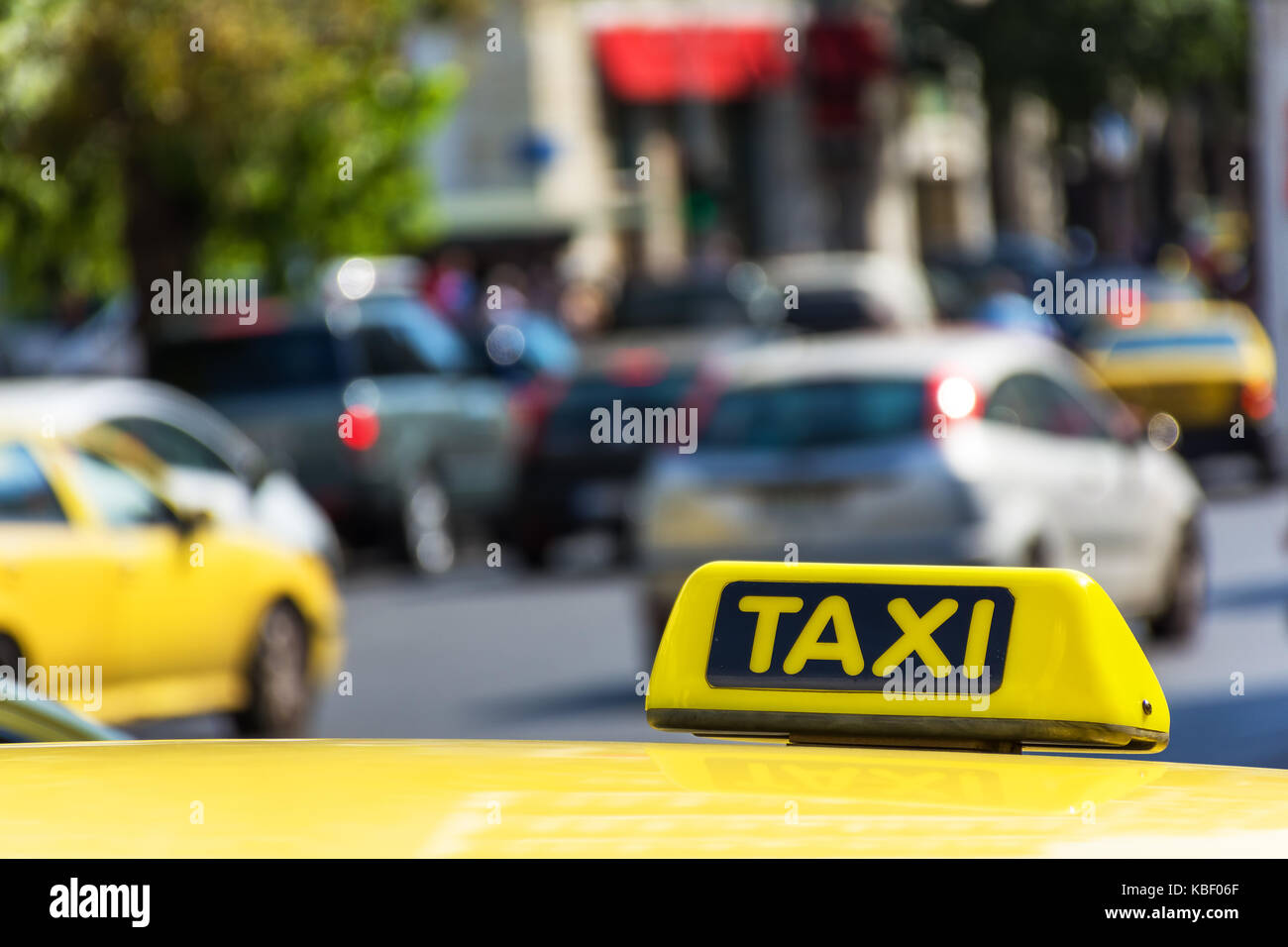 Yellow taxi sign on cab vehicle roof Stock Photo - Alamy