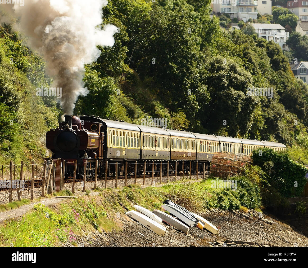 Steam train leaving Kingswear on the Dartmouth Steam Railway, hauled by ...