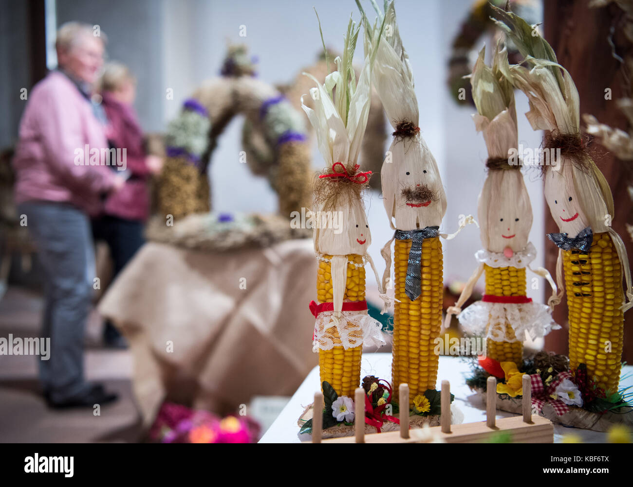 Decorations made from corn cobs can be seen ona table at the opening of ...