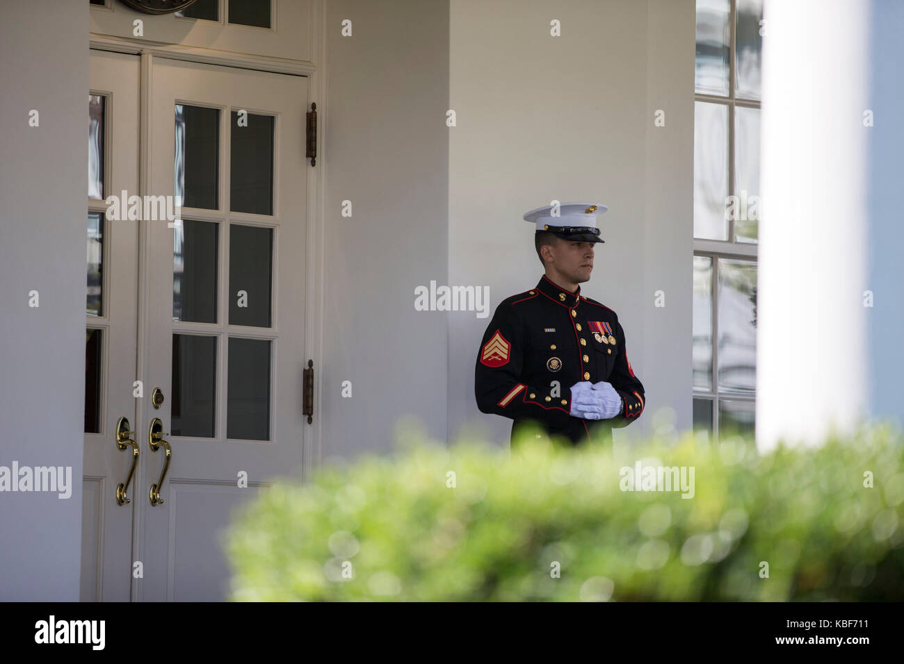 A United States Marine stands guard outside the Northern entrance to ...