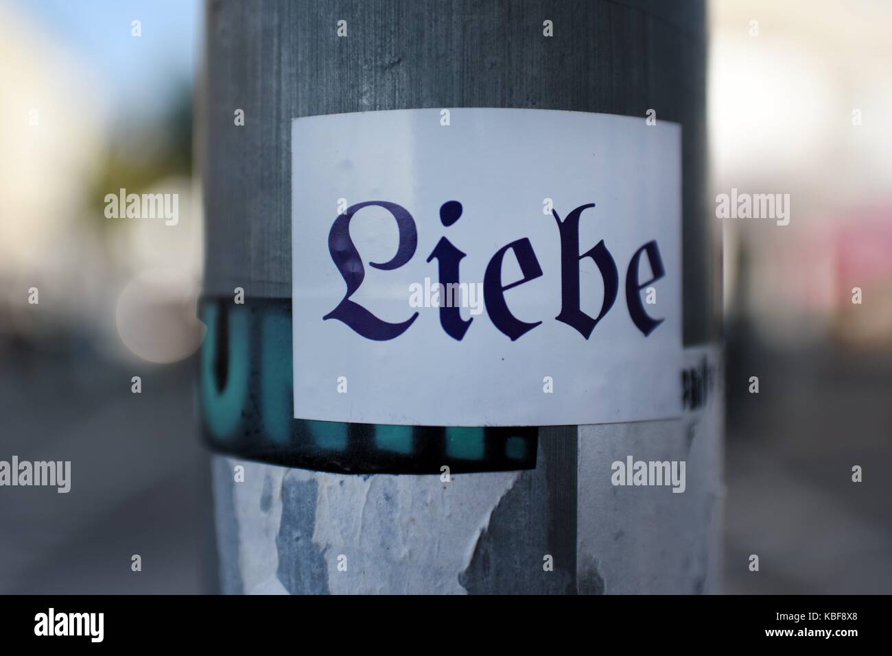 Sticker with the word Liebe (german for love) on a street lamp, Germany ...