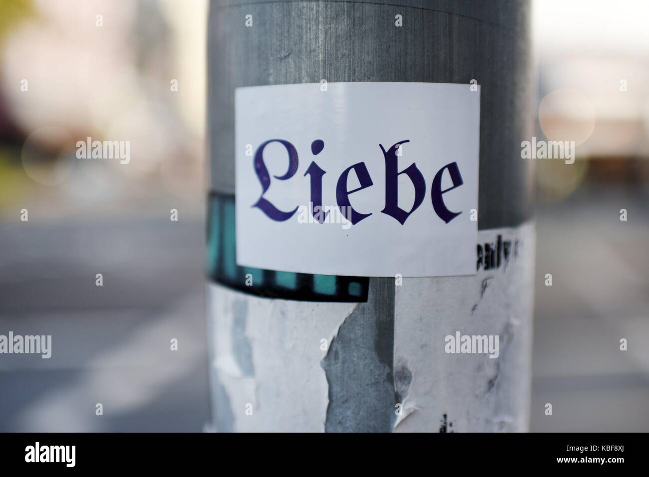 Sticker with the word Liebe (german for love) on a street lamp, Germany ...