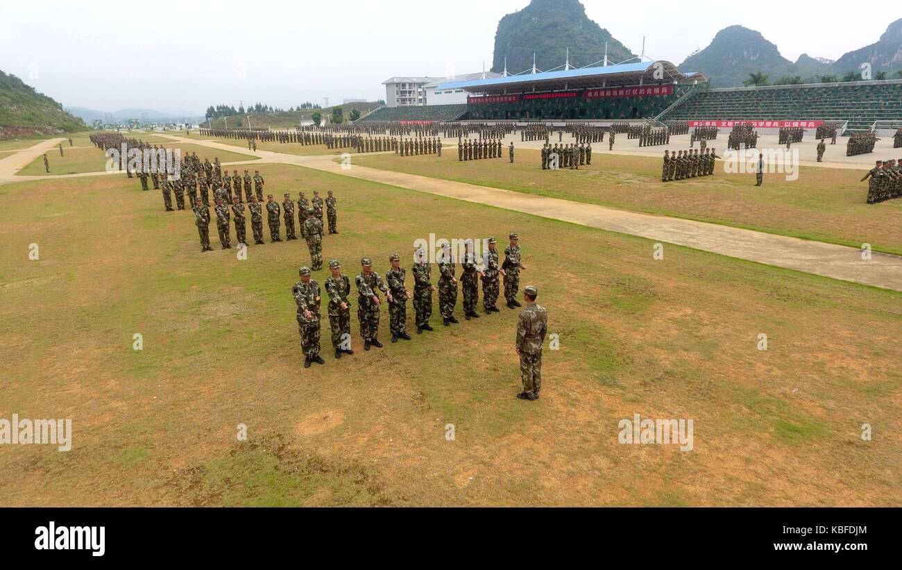 Chongzuo, China. 29th Sep, 2017. New soldiers receive military training ...