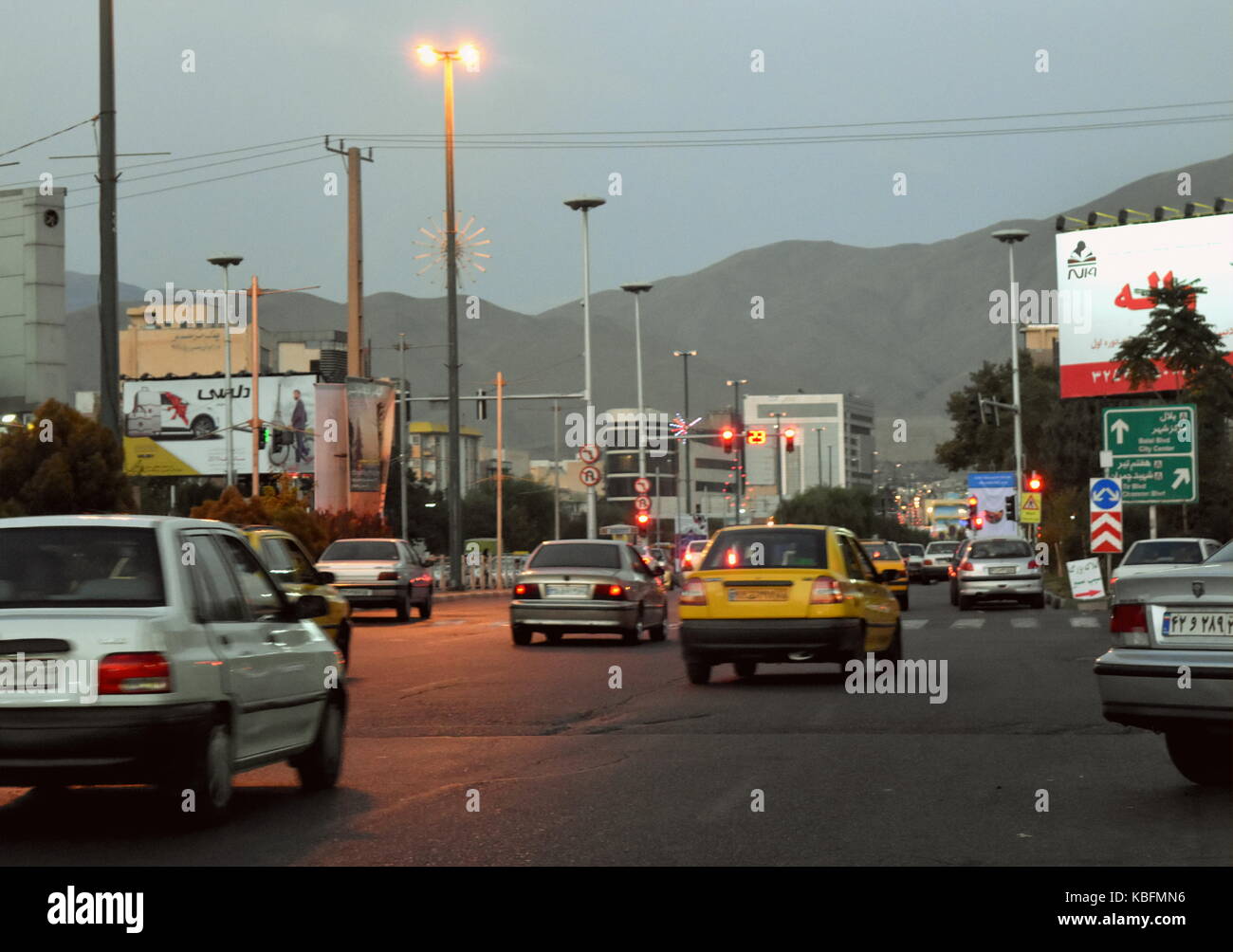 Iran street and traffic of cars and taxis at dusk - Karaj, near Tehran ...