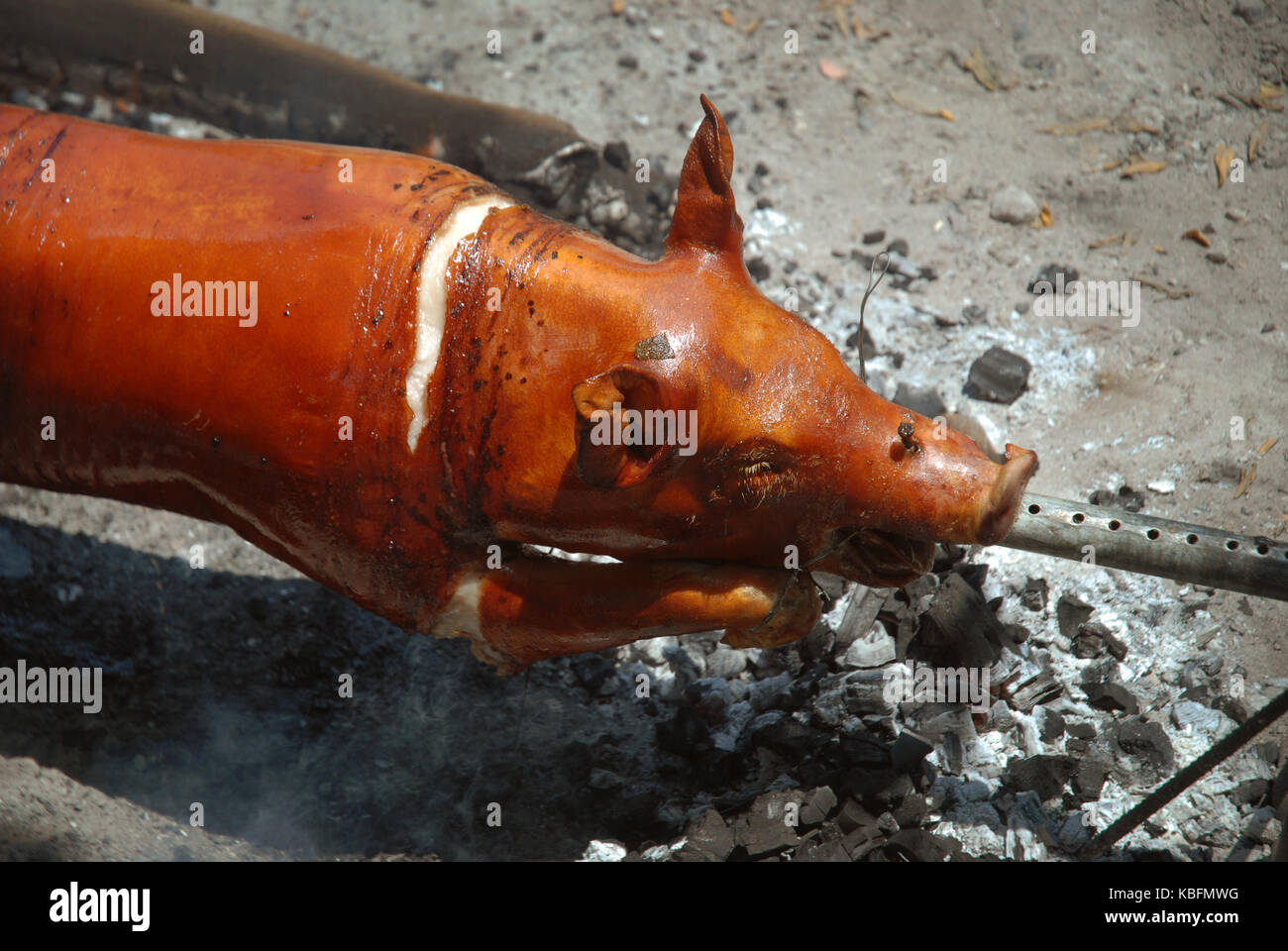 Cooking a pig on a spit on an open fire, Angeles, Philippines Stock ...