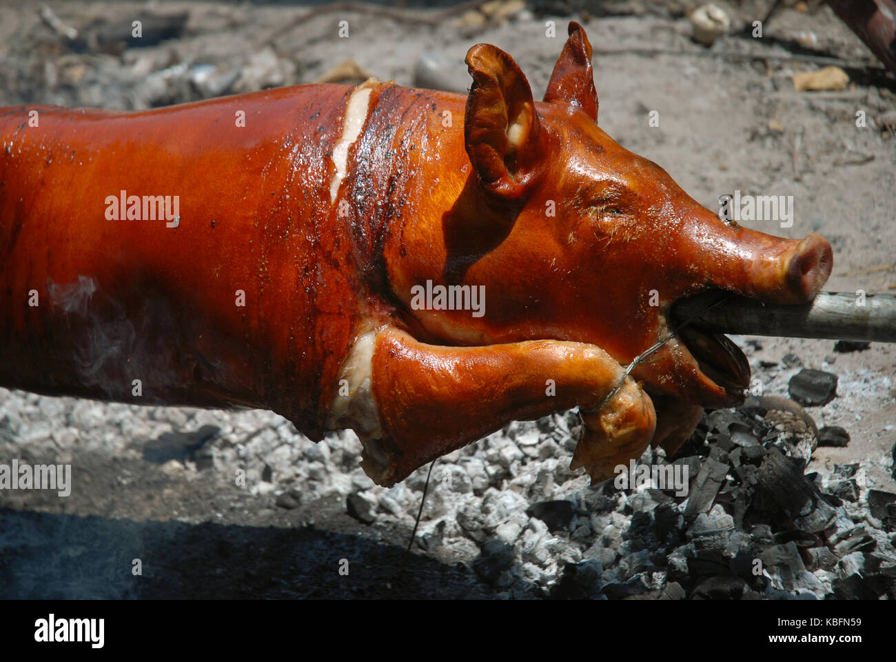 Cooking a pig on a spit on an open fire, Angeles, Philippines Stock ...