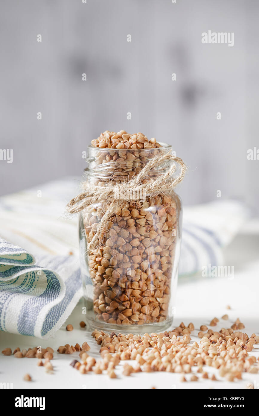 Uncooked buckwheat in glass jar. Close up Stock Photo - Alamy