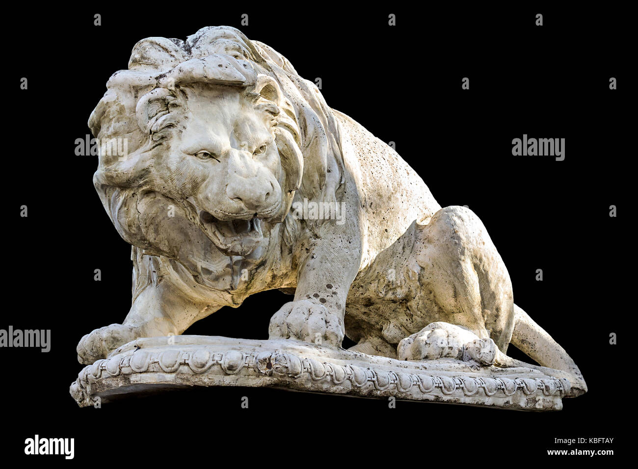 Ancient statue of a reclining lion isolated on black Stock Photo - Alamy