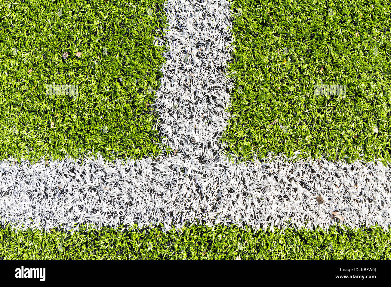 Artificial turf with white marking line Stock Photo - Alamy