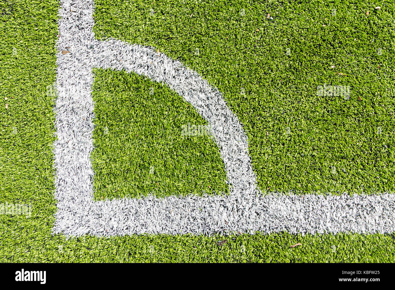 Artificial turf conner with white marking line Stock Photo - Alamy