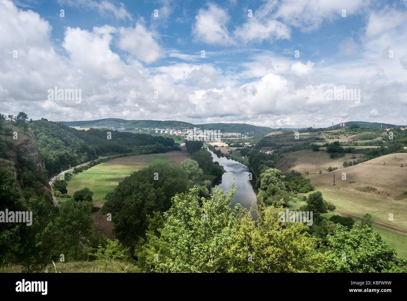 Berounka river with countryside around, Beroun city and hills on the ...