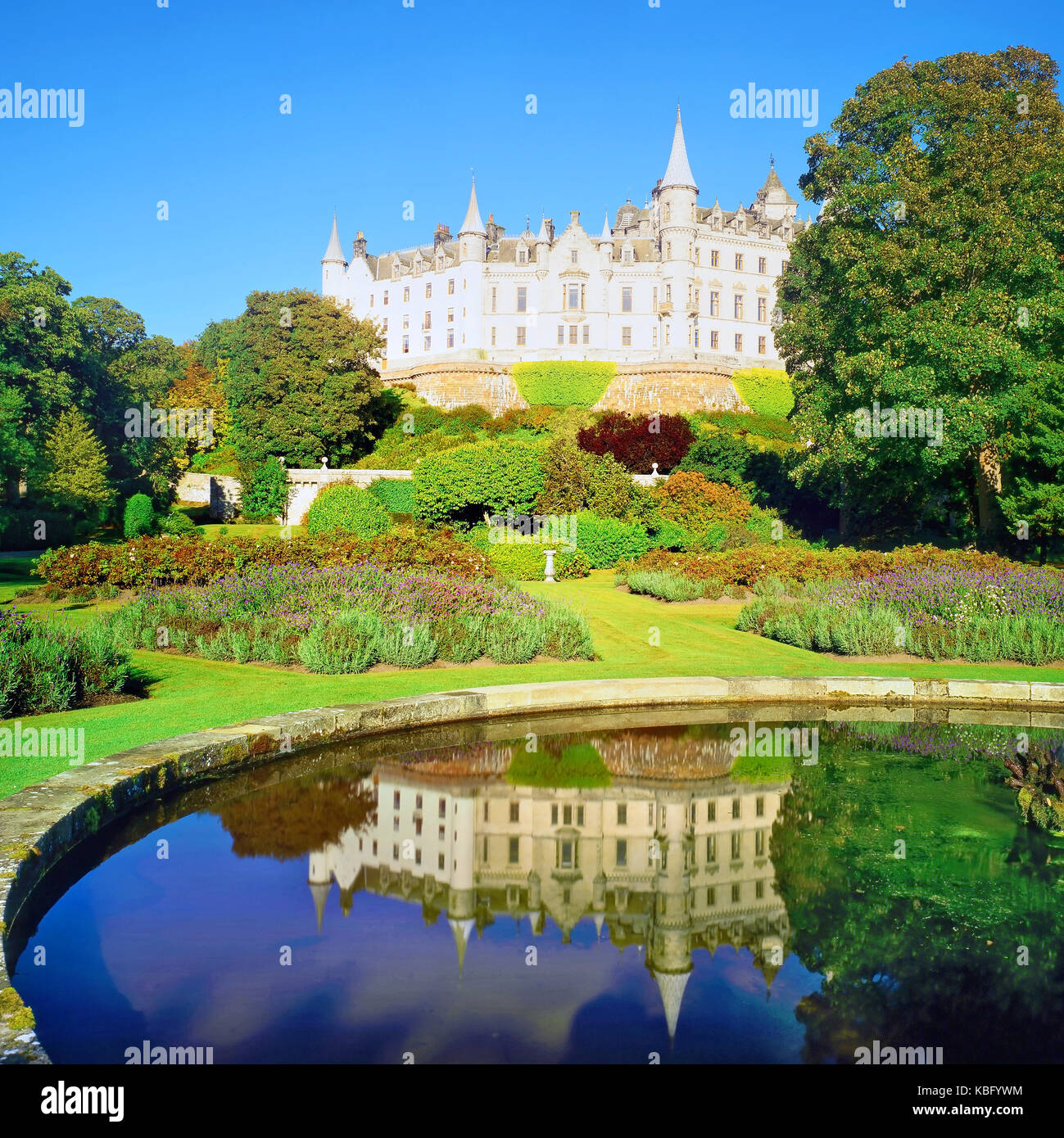 A sunny view of historic Dunrobin Castle looking across its extensive ...