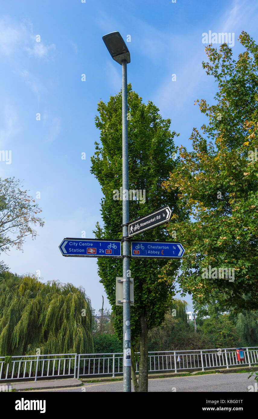 Street light with direction signs Stock Photo - Alamy