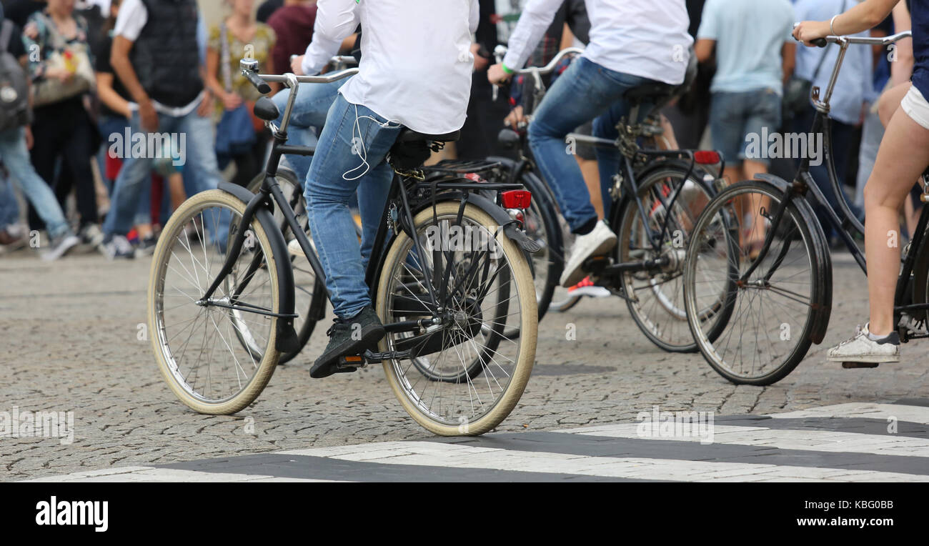 many people riding bicycles in Amsterdam in the Netherlands Stock Photo ...