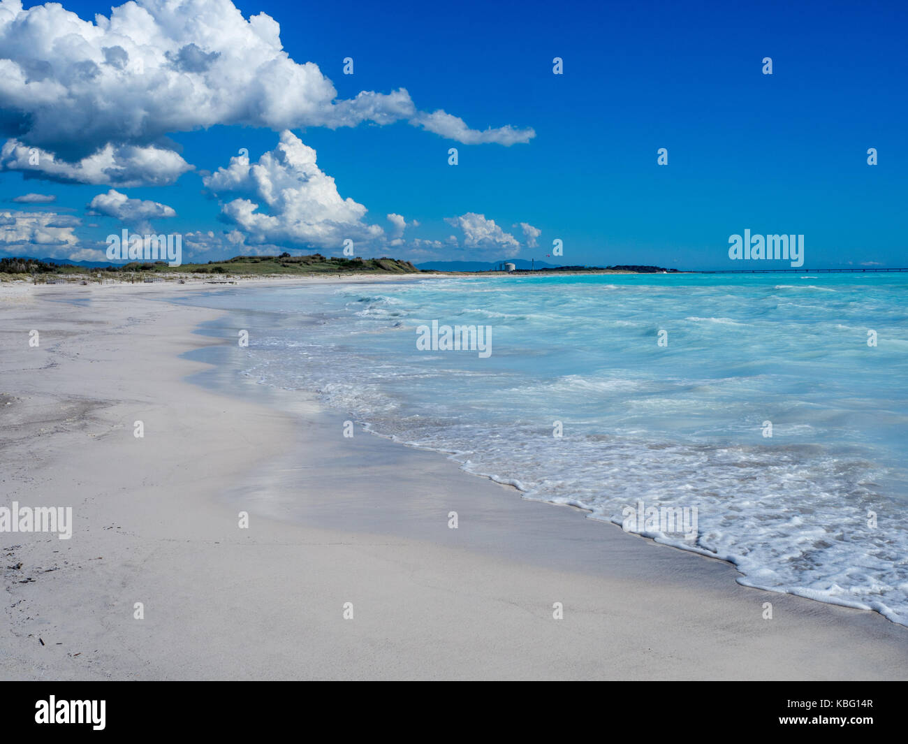 Ocean seascape. White rock or pebble in a white sandy beach under blue ...