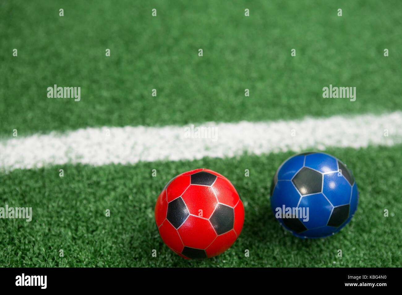 Footballs on grass hi-res stock photography and images - Alamy