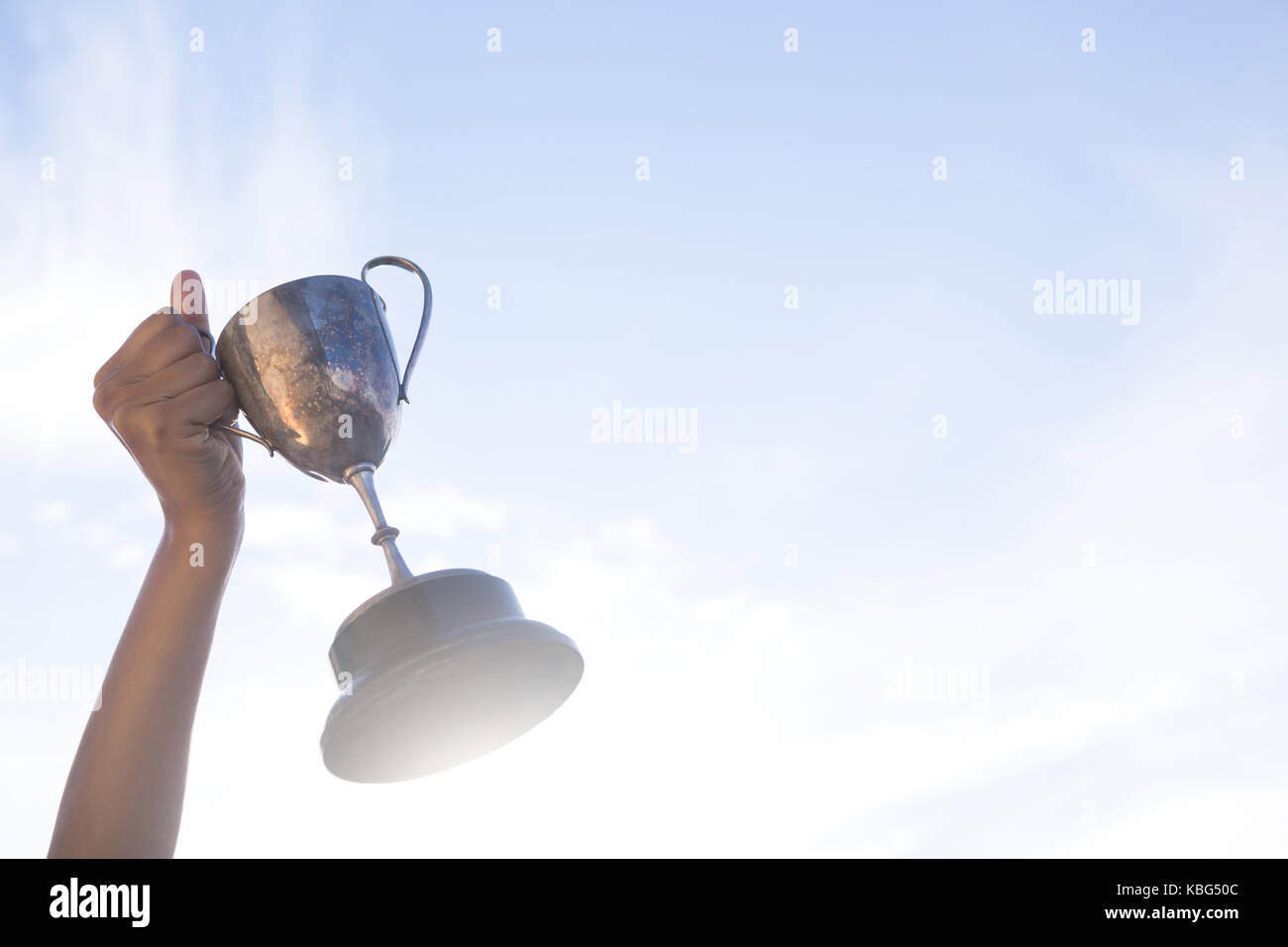 Hand holding trophy hi-res stock photography and images - Alamy