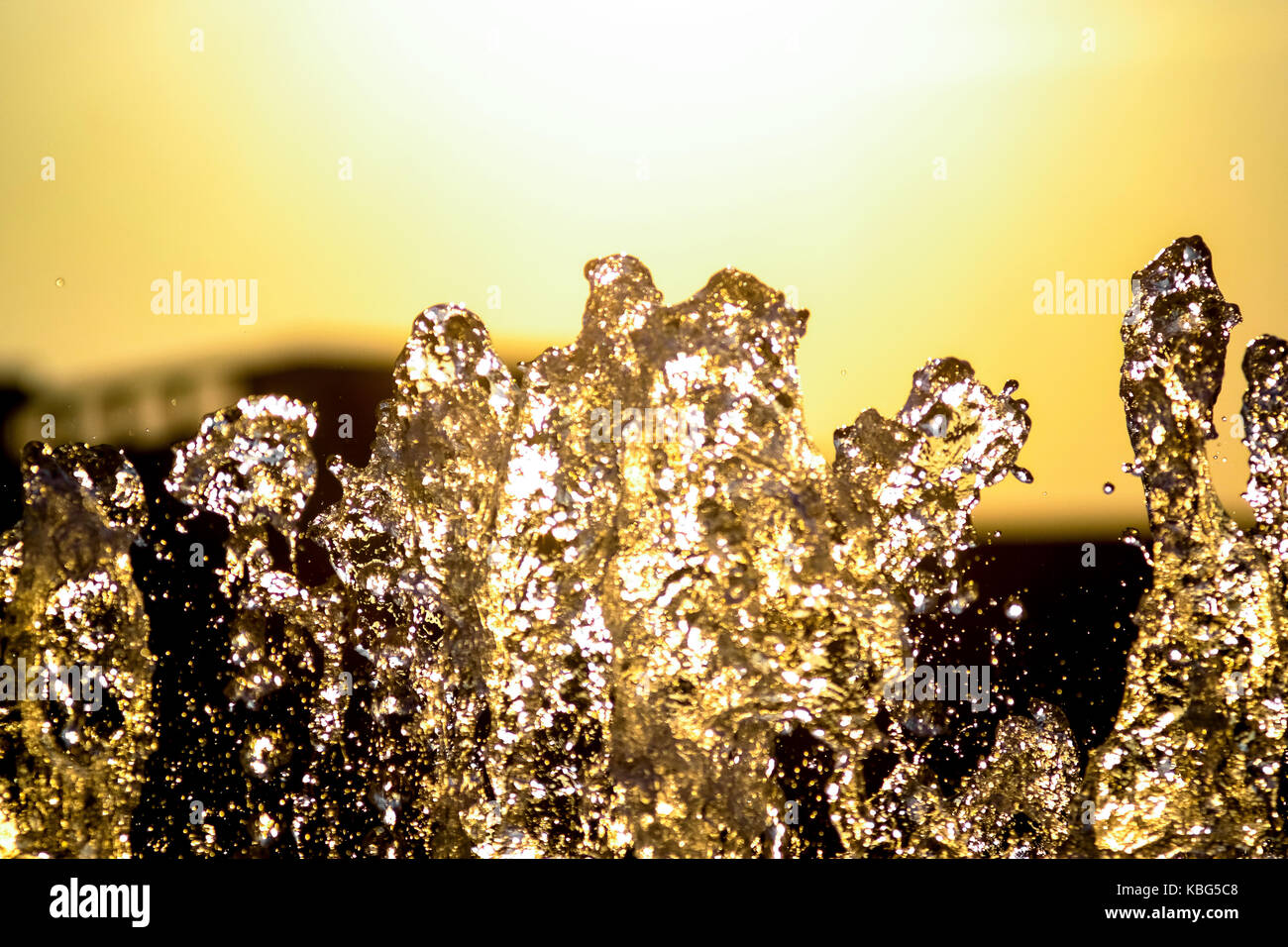 Water spring against the golden sunlight, sunset time Stock Photo - Alamy