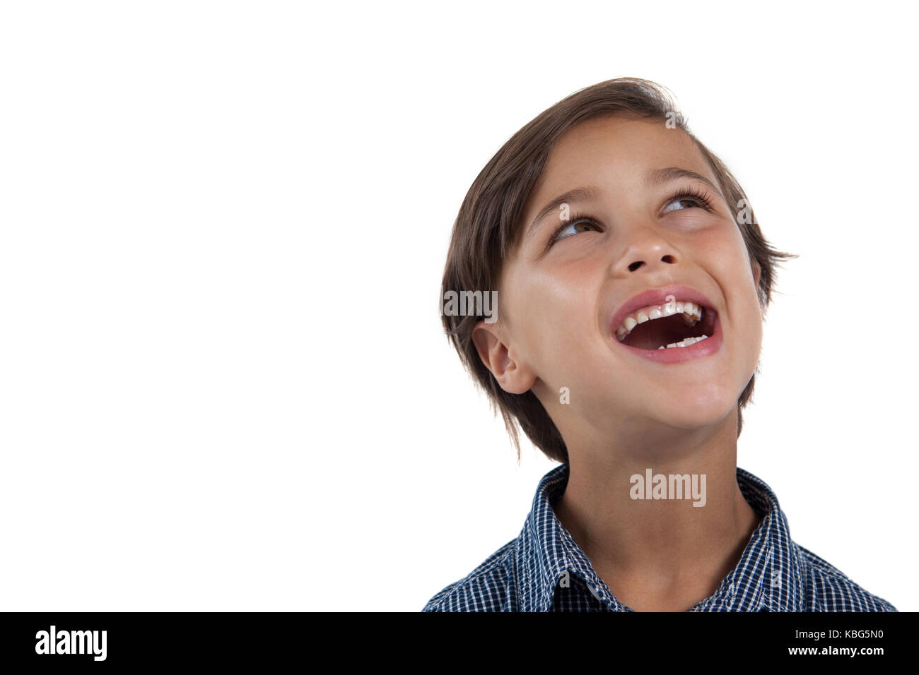 Happy boy standing against white background Stock Photo - Alamy