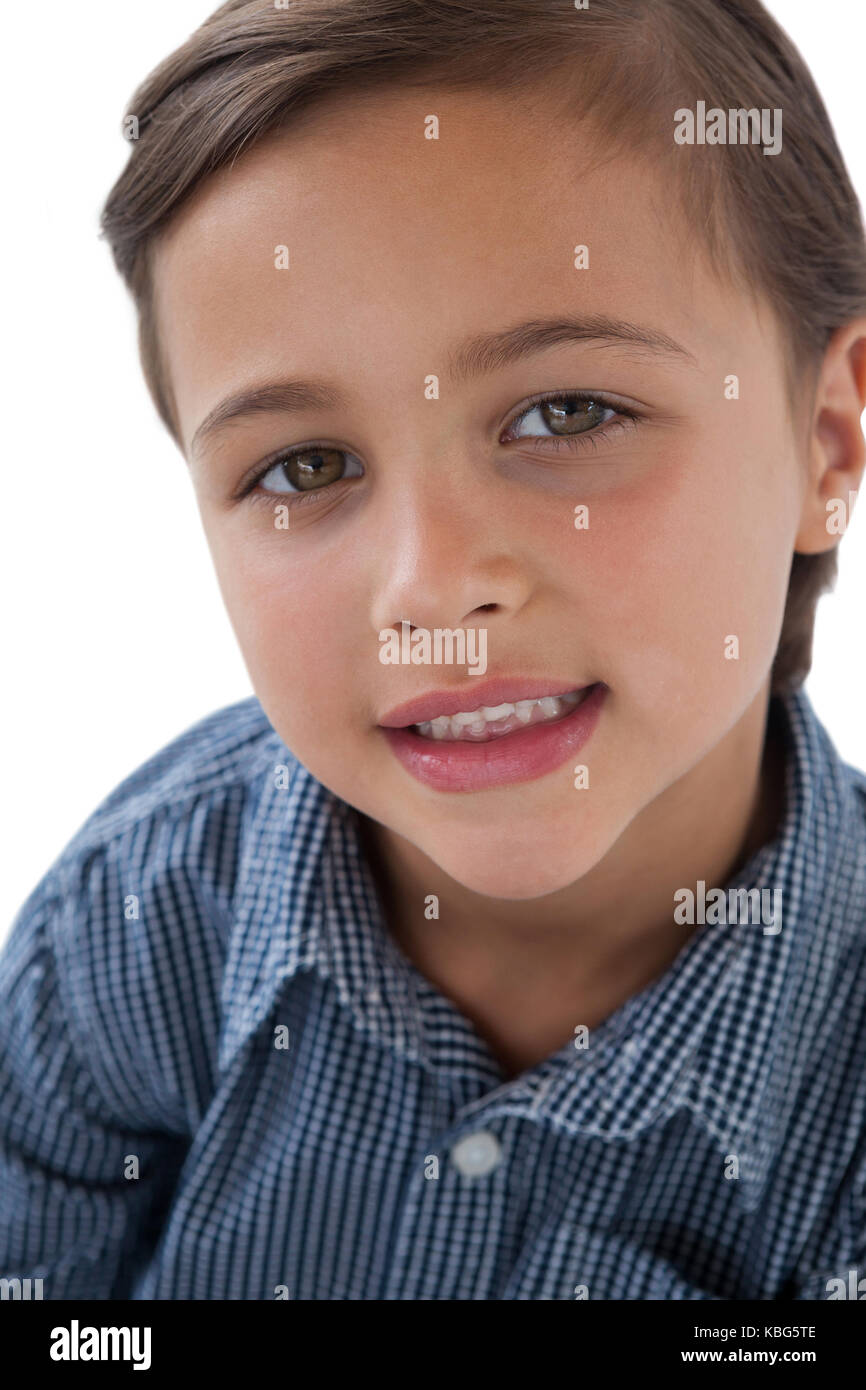 Portrait of smiling boy against white background Stock Photo - Alamy