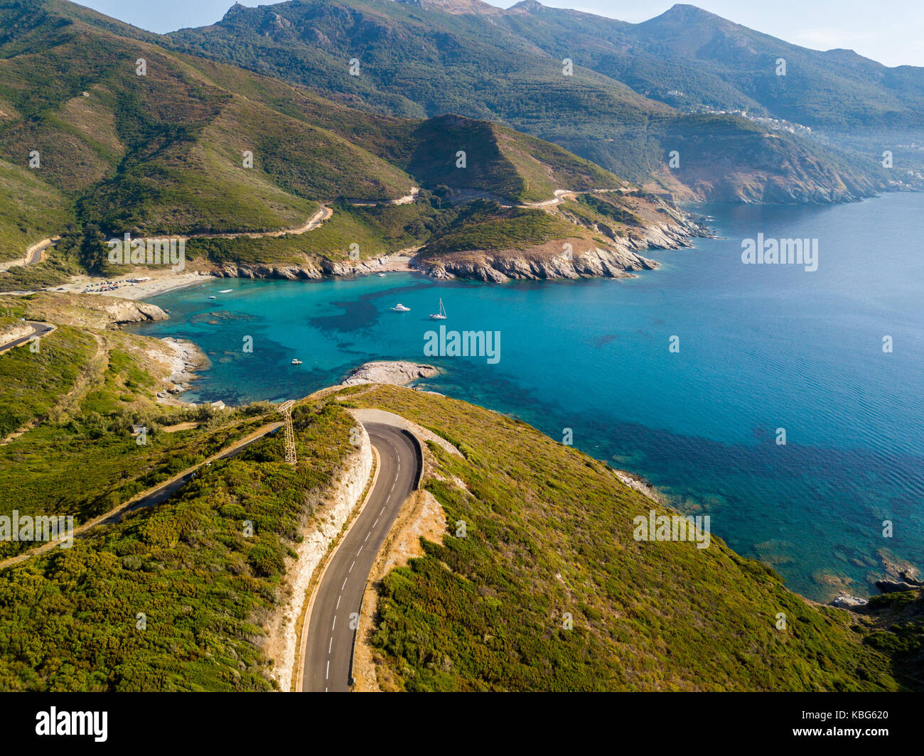 Aerial view of the coast of Corsica, winding roads and coves with ...