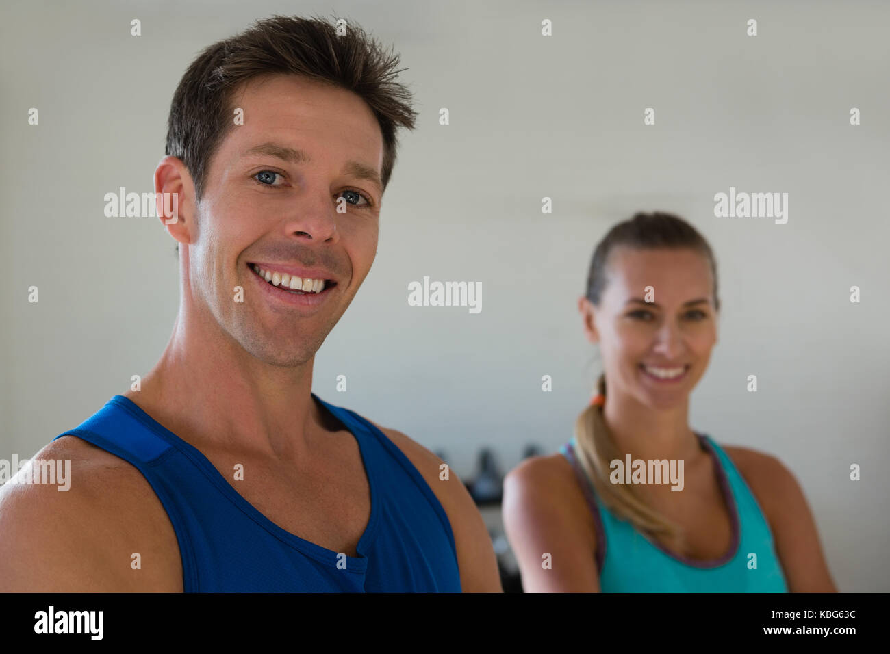 Portrait of smiling confident athletes standing in gym Stock Photo - Alamy
