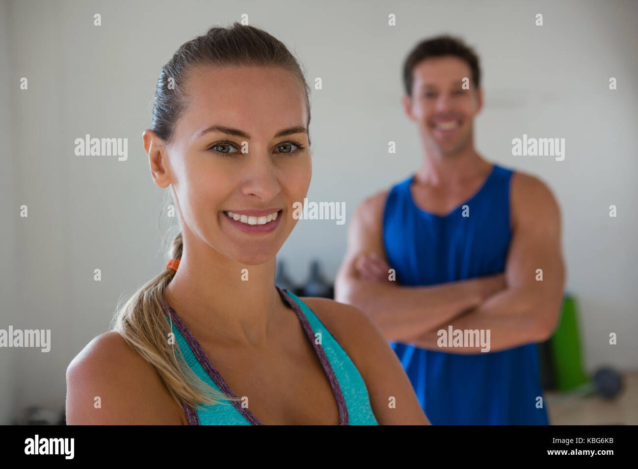 Portrait of confident happy athletes standing in gym Stock Photo - Alamy