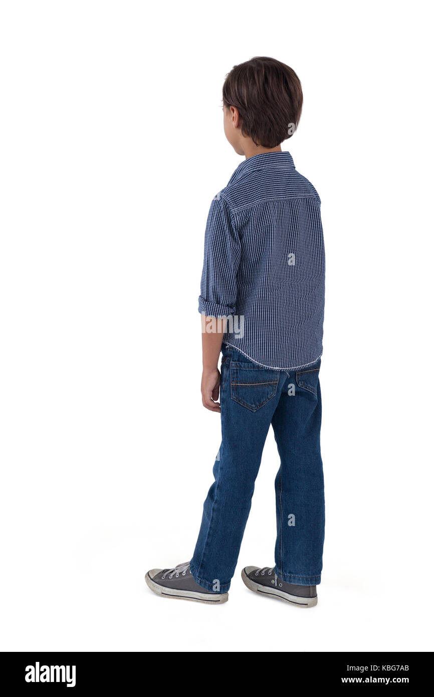 Thoughtful boy standing against white background Stock Photo - Alamy