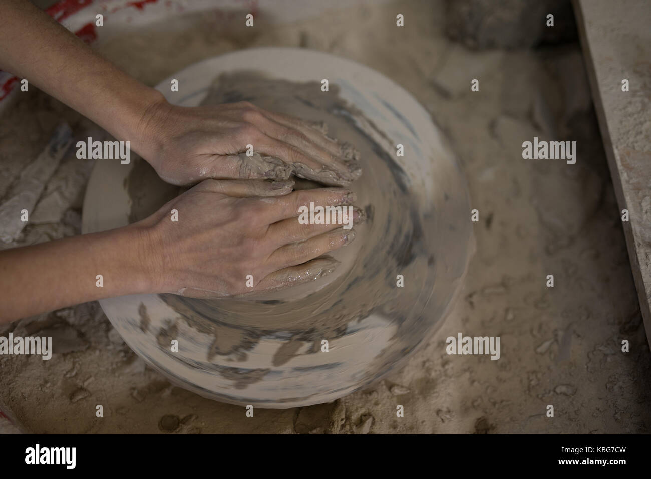 Close-up of female potter molding clay in pottery workshop Stock Photo ...