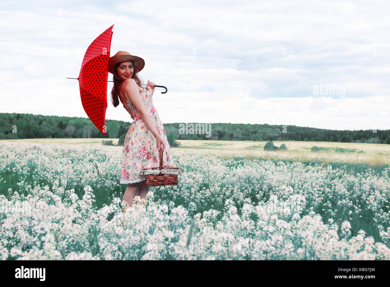 girl in a summer meadow with white flower Stock Photo - Alamy